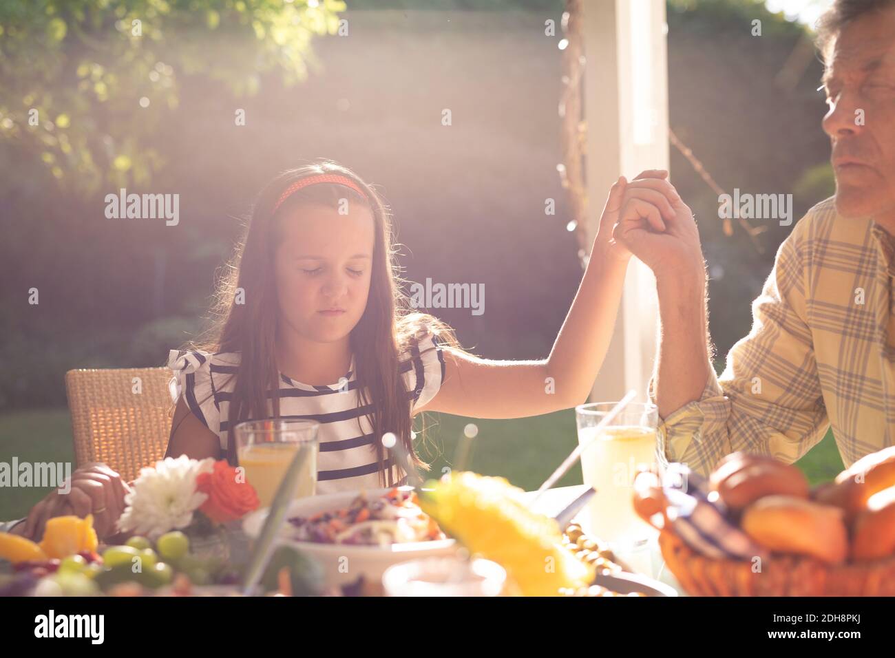 Family eating outside together in summer Stock Photo - Alamy