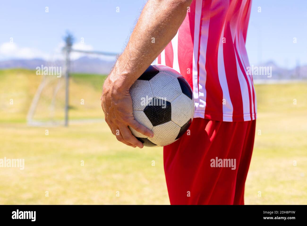 Soccer player with ball Stock Photo - Alamy