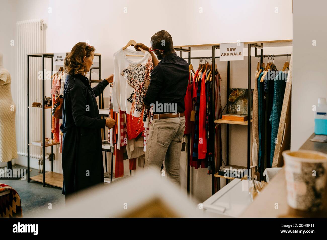 Retail customer salesperson clothes hi-res stock photography and images ...