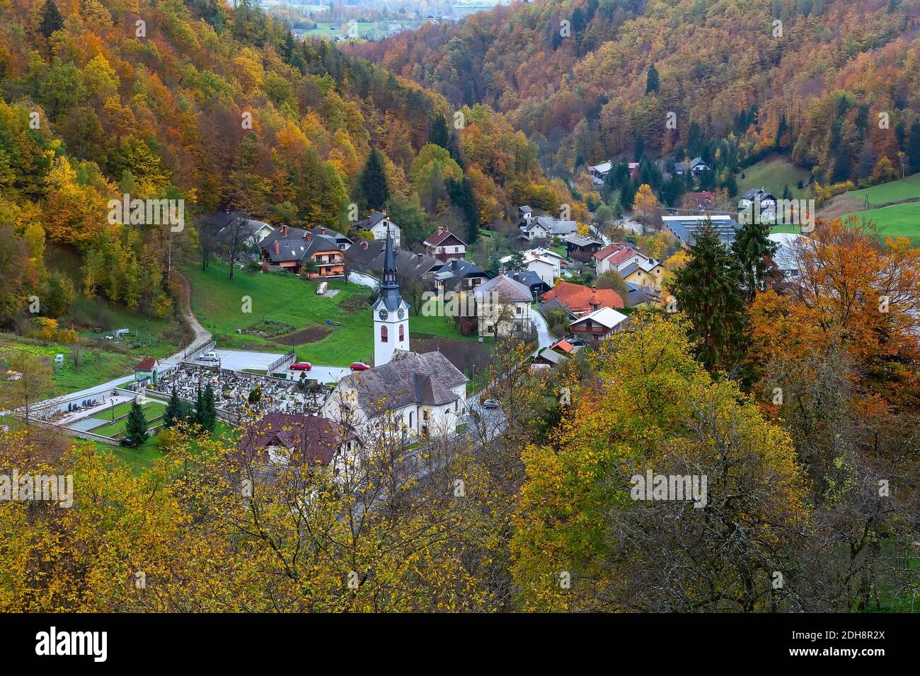 Mountain village, autumn forest trees, Slovenia Stock Photo - Alamy