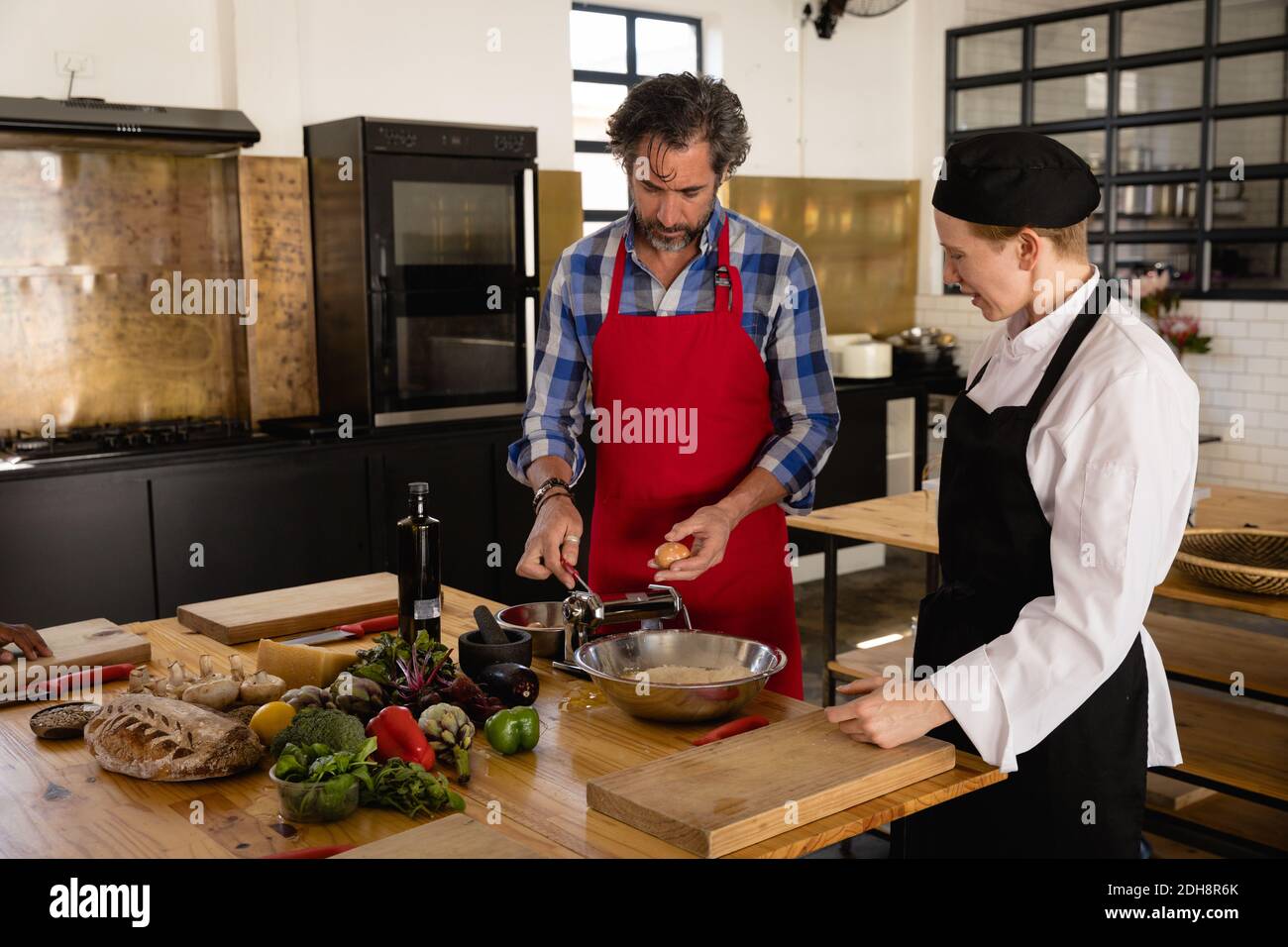 Chefs cooking together Stock Photo - Alamy
