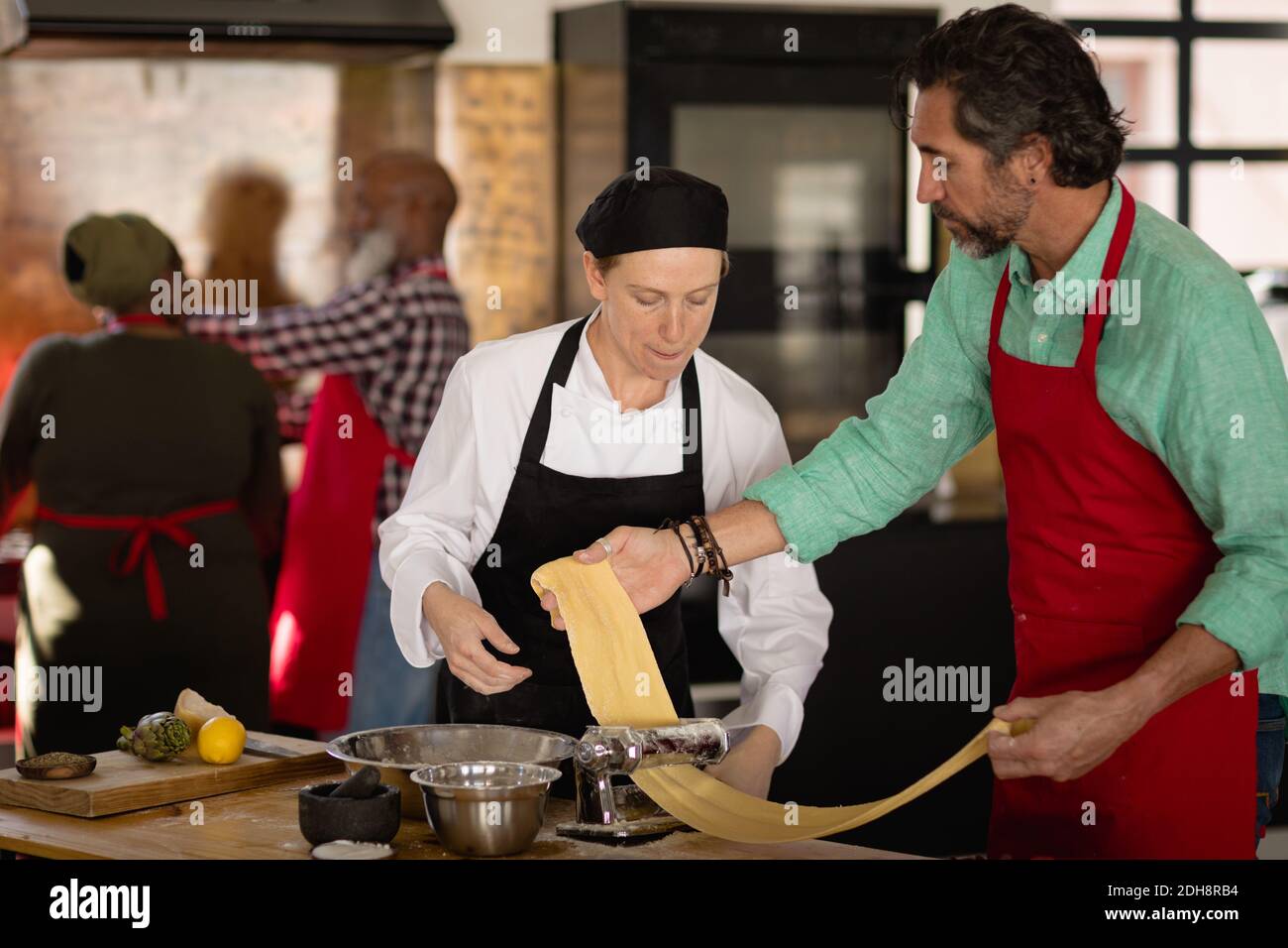 Chefs enjoying cooking Stock Photo - Alamy