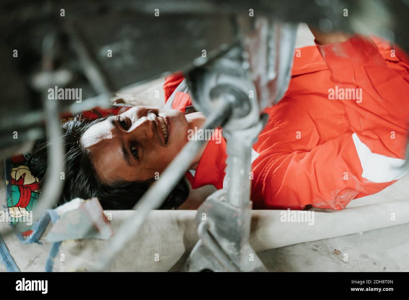 portrait of young asian man repairing a broken car engine part Stock ...