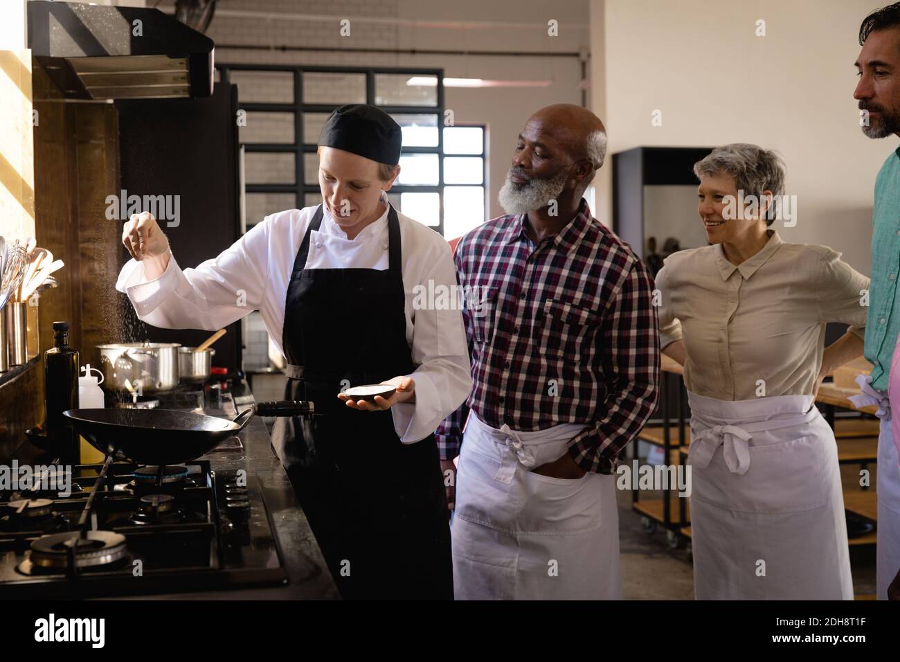 Chefs enjoying cooking together Stock Photo - Alamy