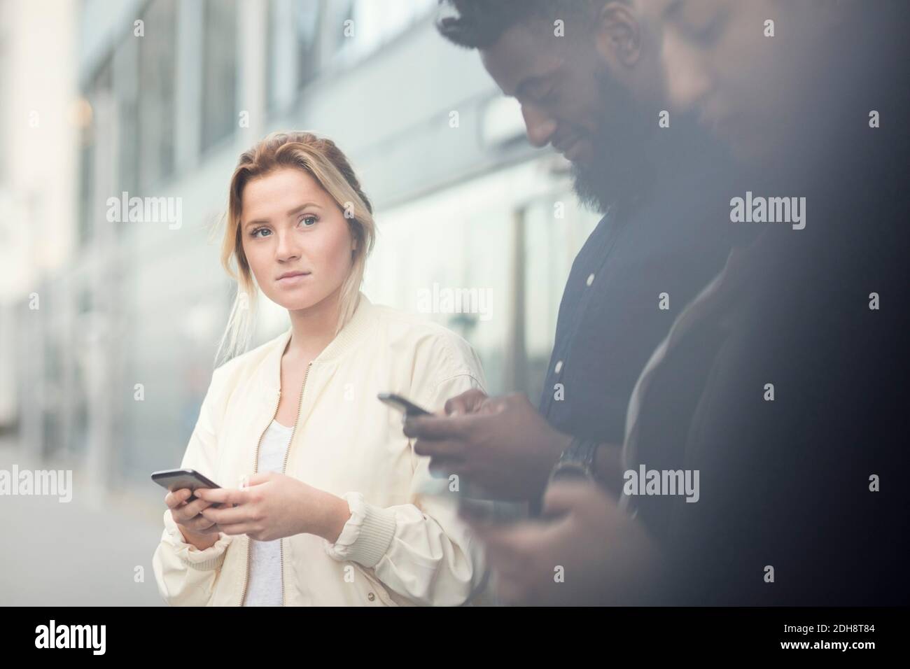 People looking at their phones hi-res stock photography and images - Alamy