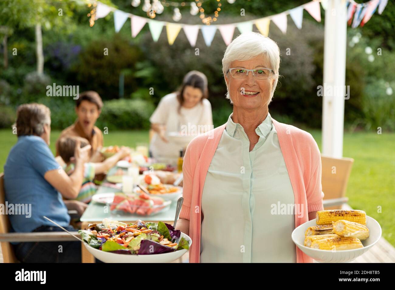 Family eating outside together in summer Stock Photo - Alamy