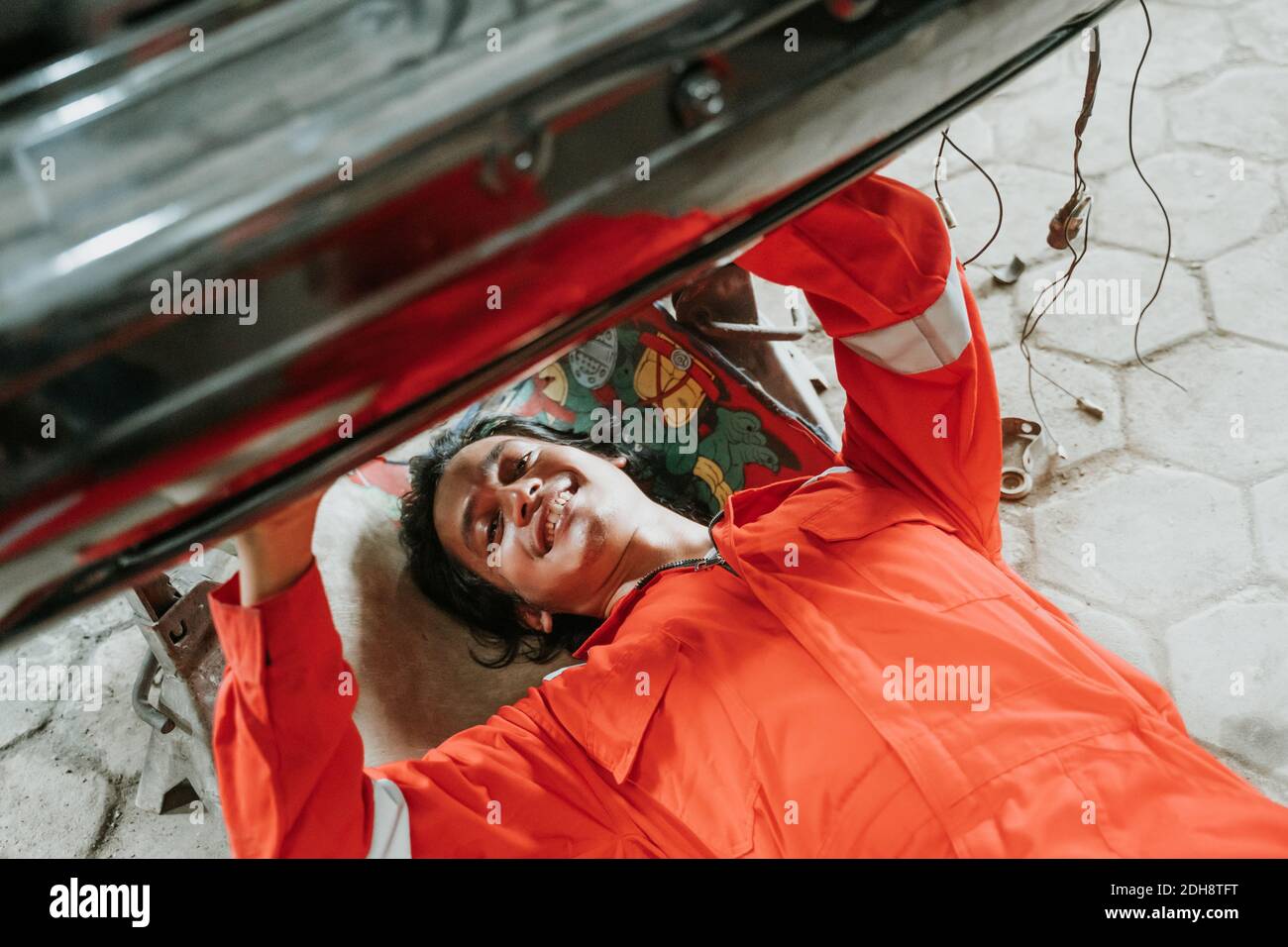 portrait of young asian man repairing a broken car engine part Stock ...