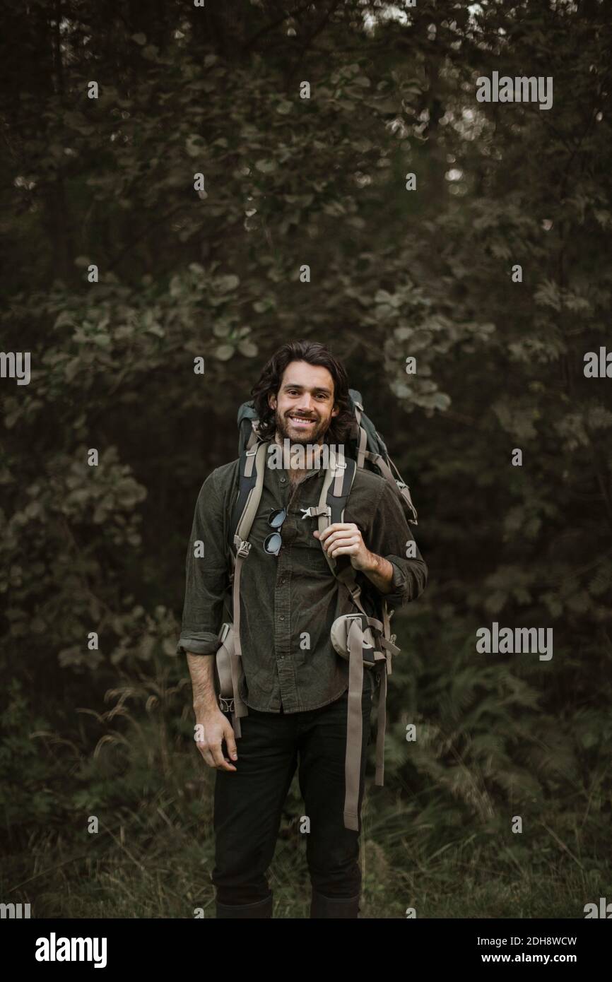Portrait of smiling man with backpack hi-res stock photography and ...