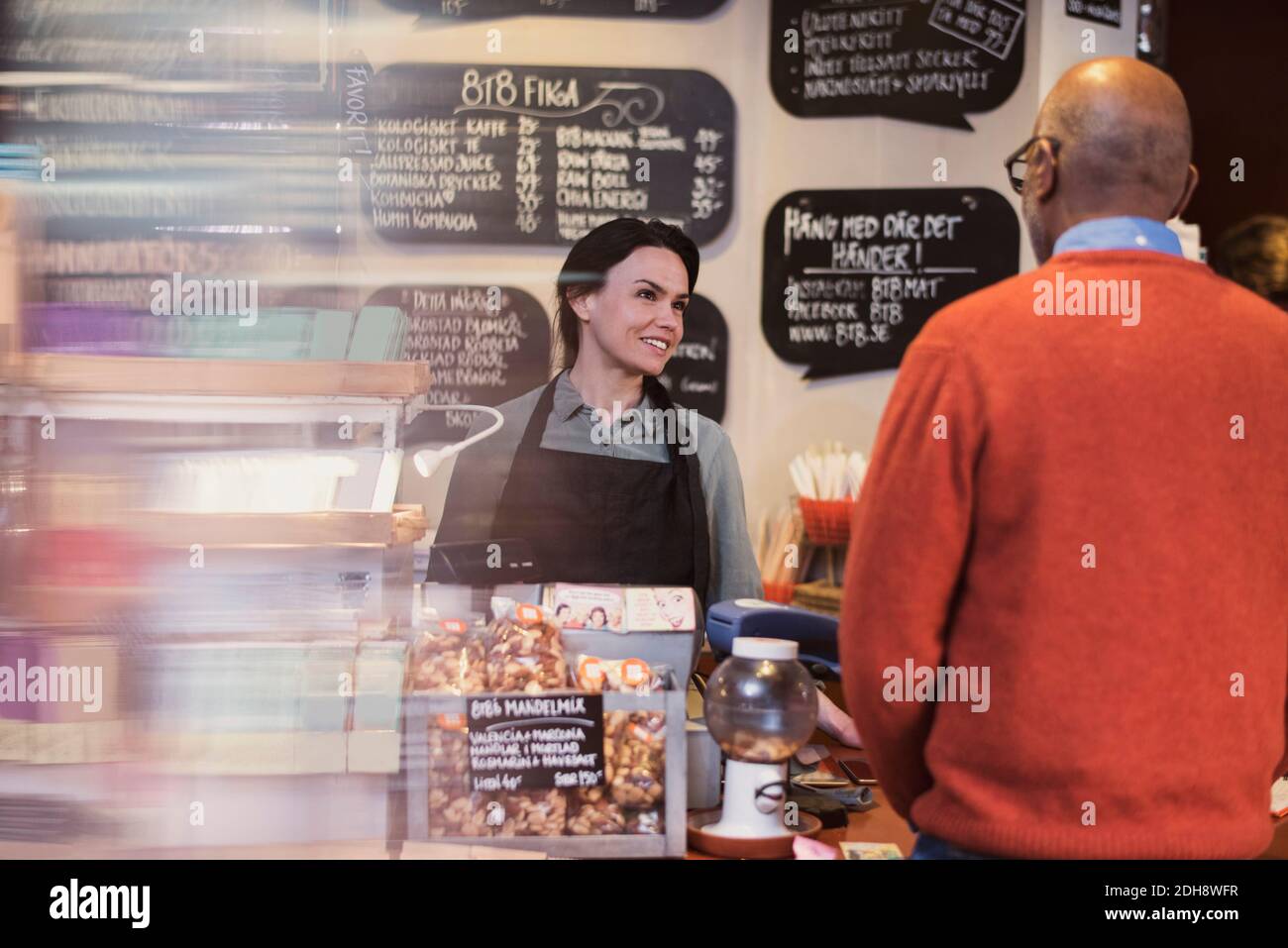 Women talking to shop assistant hi-res stock photography and images - Alamy