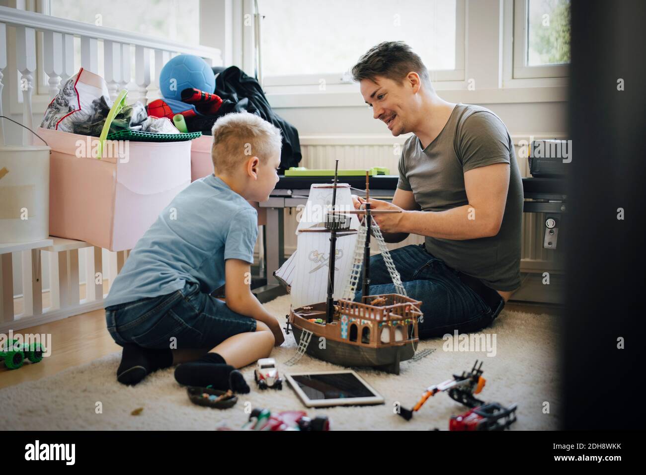 Boys with toy boat hi-res stock photography and images - Alamy