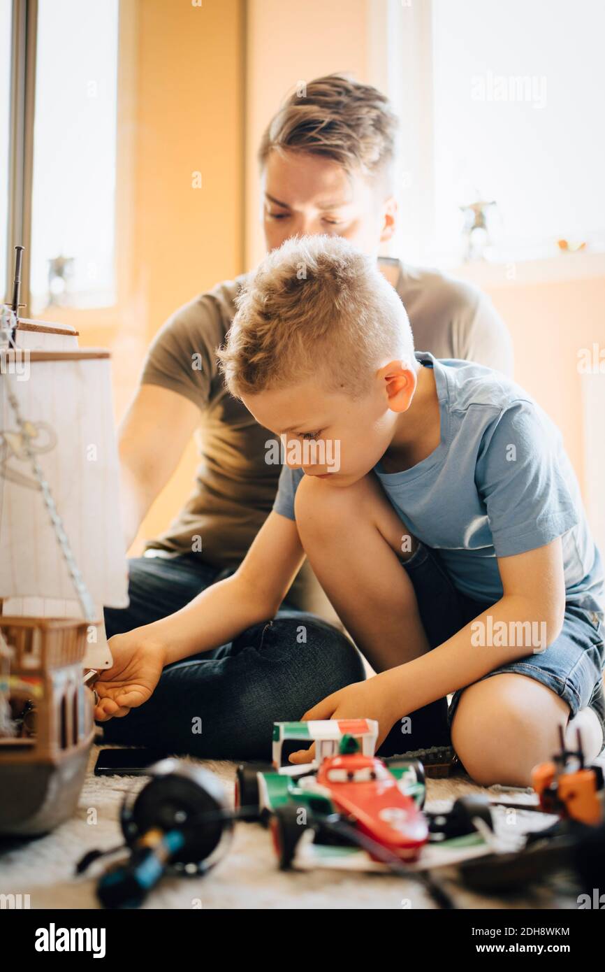 Boys with toy boat hi-res stock photography and images - Alamy