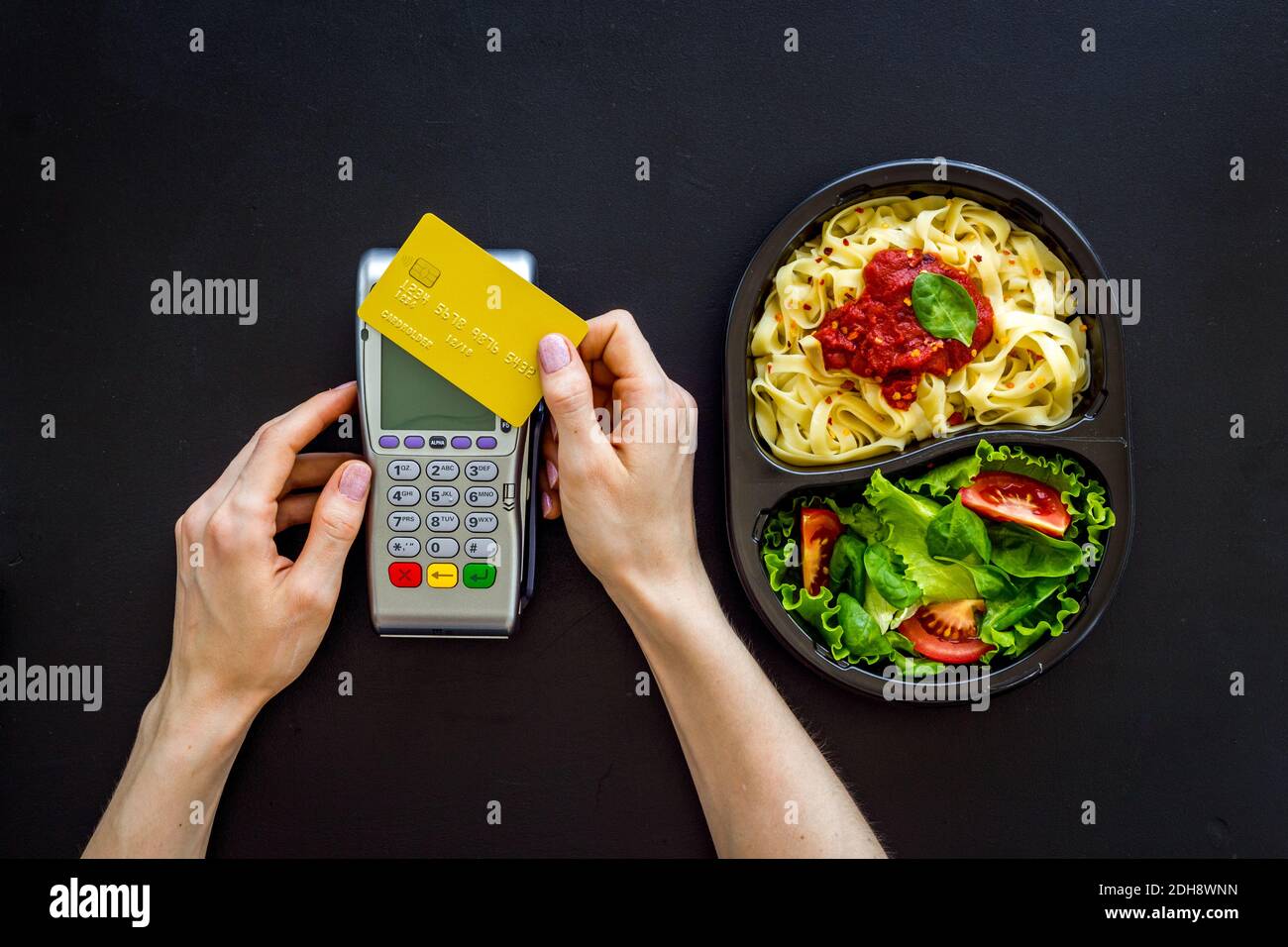 Food delivery payment with terminal and lunch boxes with meal Stock ...