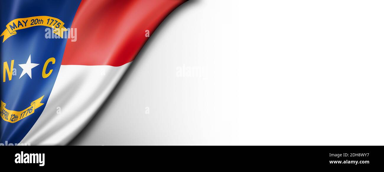 North Carolina flag on white wall banner, USA Stock Photo - Alamy
