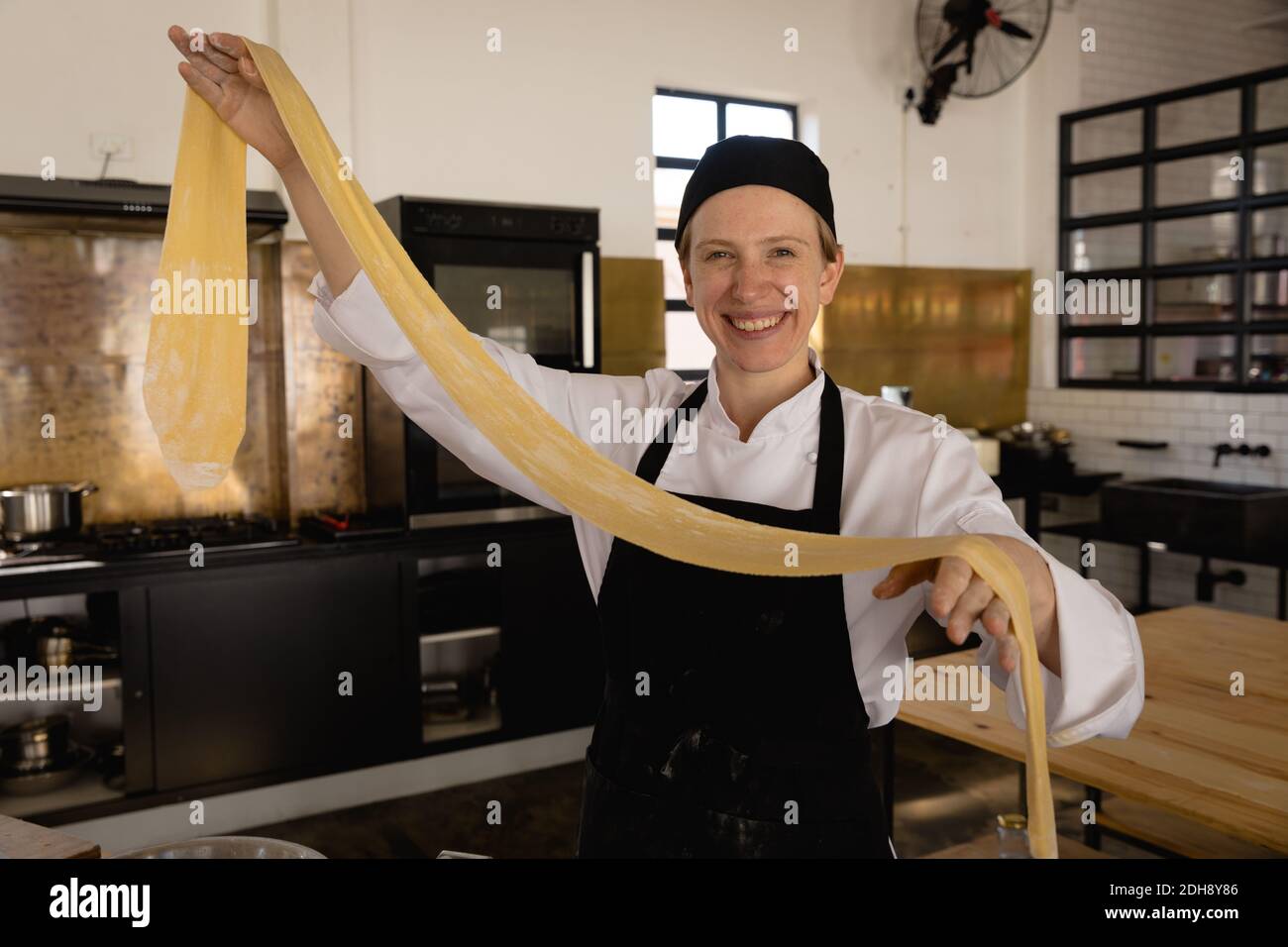 Chef proud of her smiling at the camera Stock Photo - Alamy