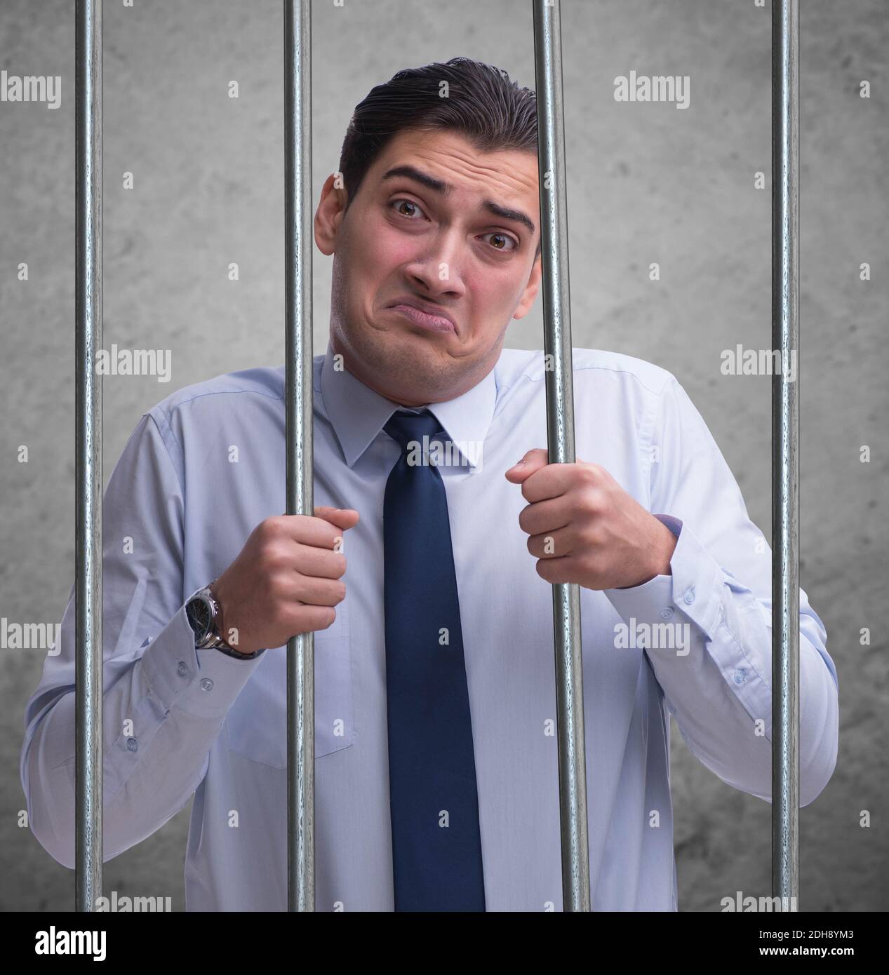 Young businessman behind the bars in prison Stock Photo - Alamy