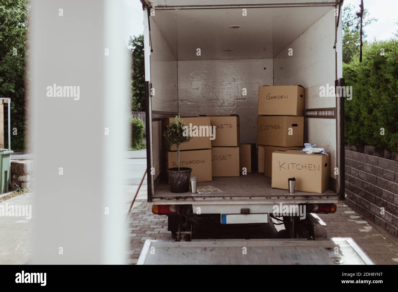 Cardboard boxes arranged in back of moving truck Stock Photo - Alamy