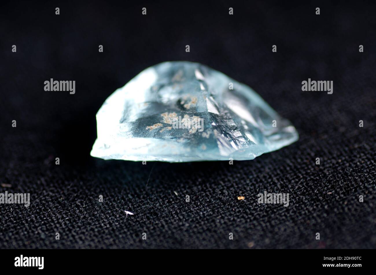 vibrant blue clrea beryl crystal mineral sample on black background ...