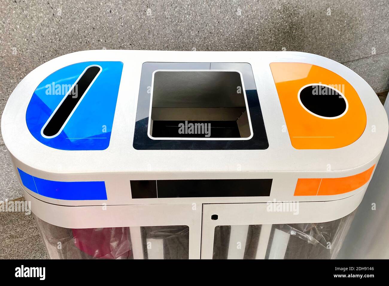 recycle bins in the bus stop Stock Photo - Alamy