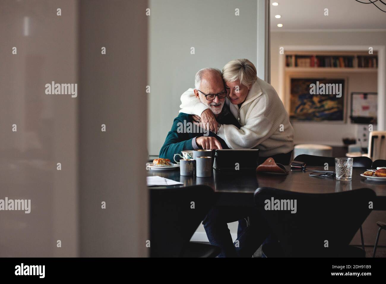 Woman bending over table hi-res stock photography and images - Alamy