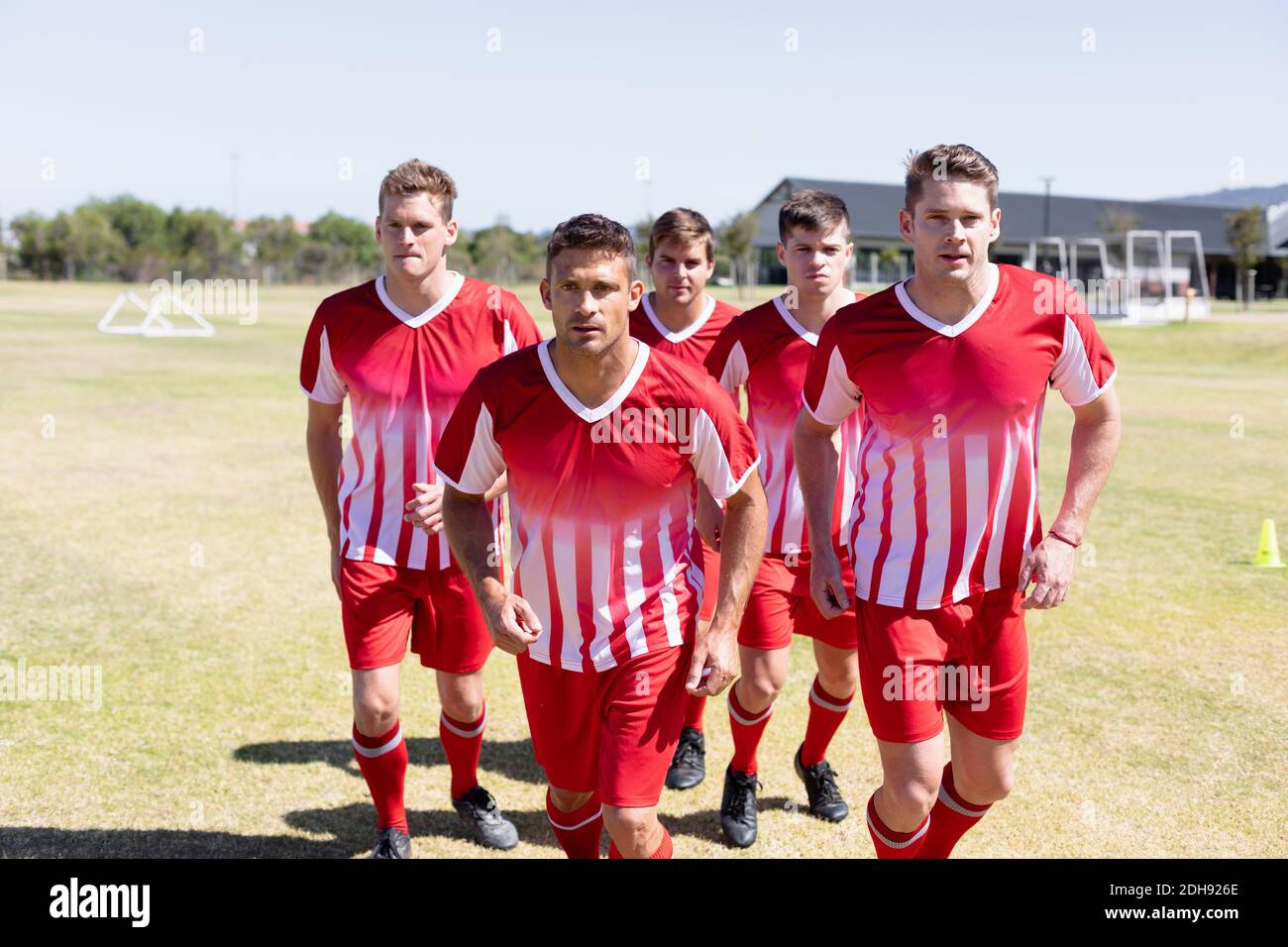 Five men running hi-res stock photography and images - Alamy