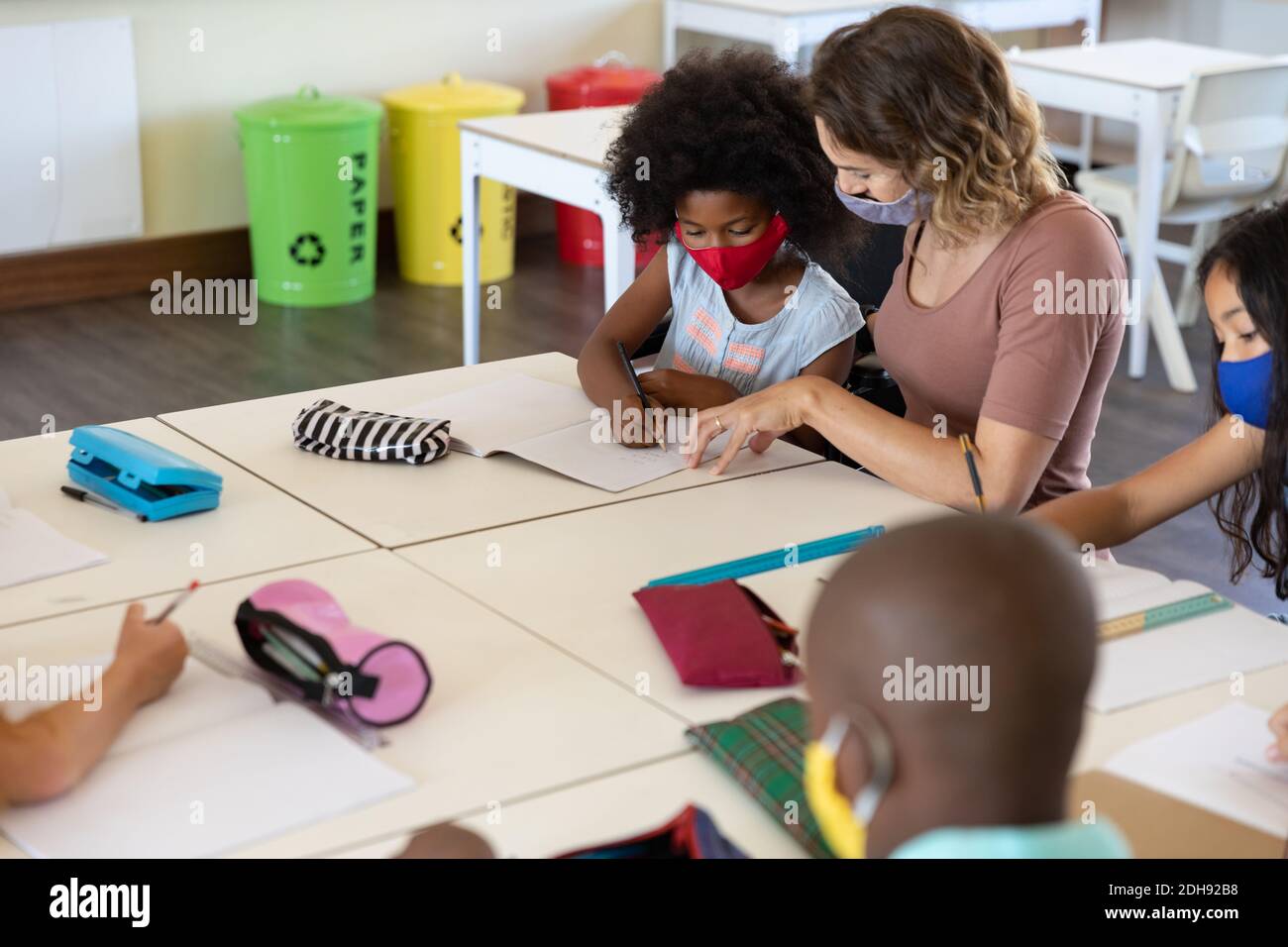 Female teacher wearing face mask hi-res stock photography and images ...