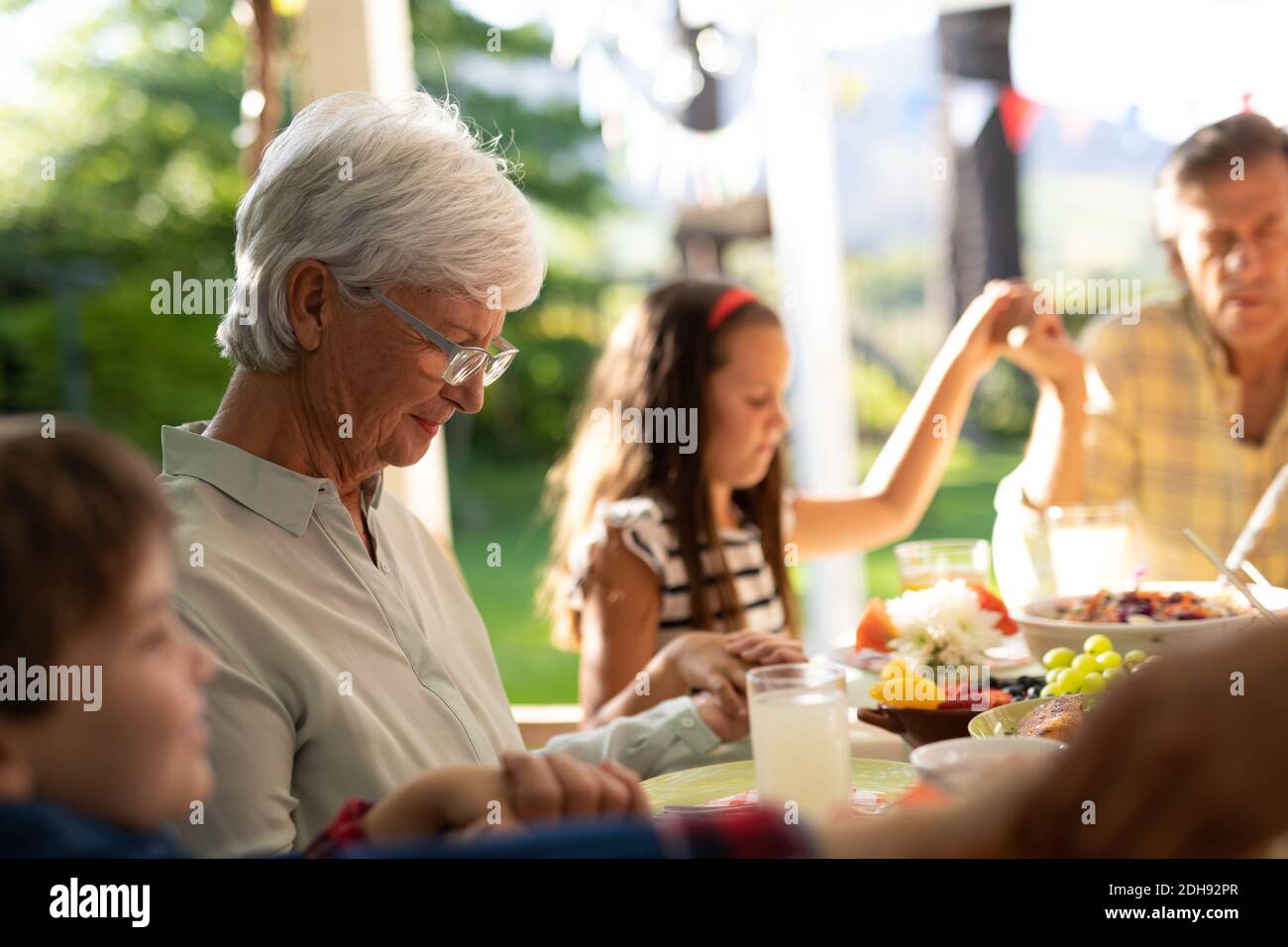 Family meal outside hands hi-res stock photography and images - Alamy