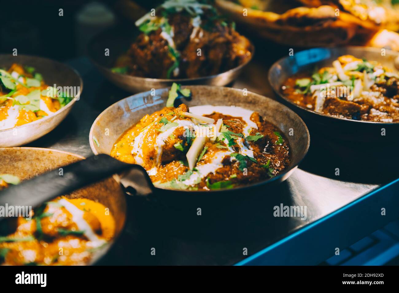 High angle view of indian food served on concession stand of commercial ...
