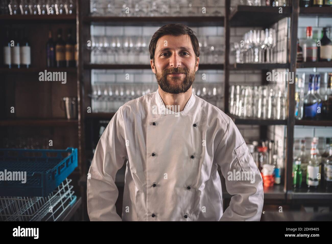 Portrait of smiling chef in commercial kitchen Stock Photo - Alamy