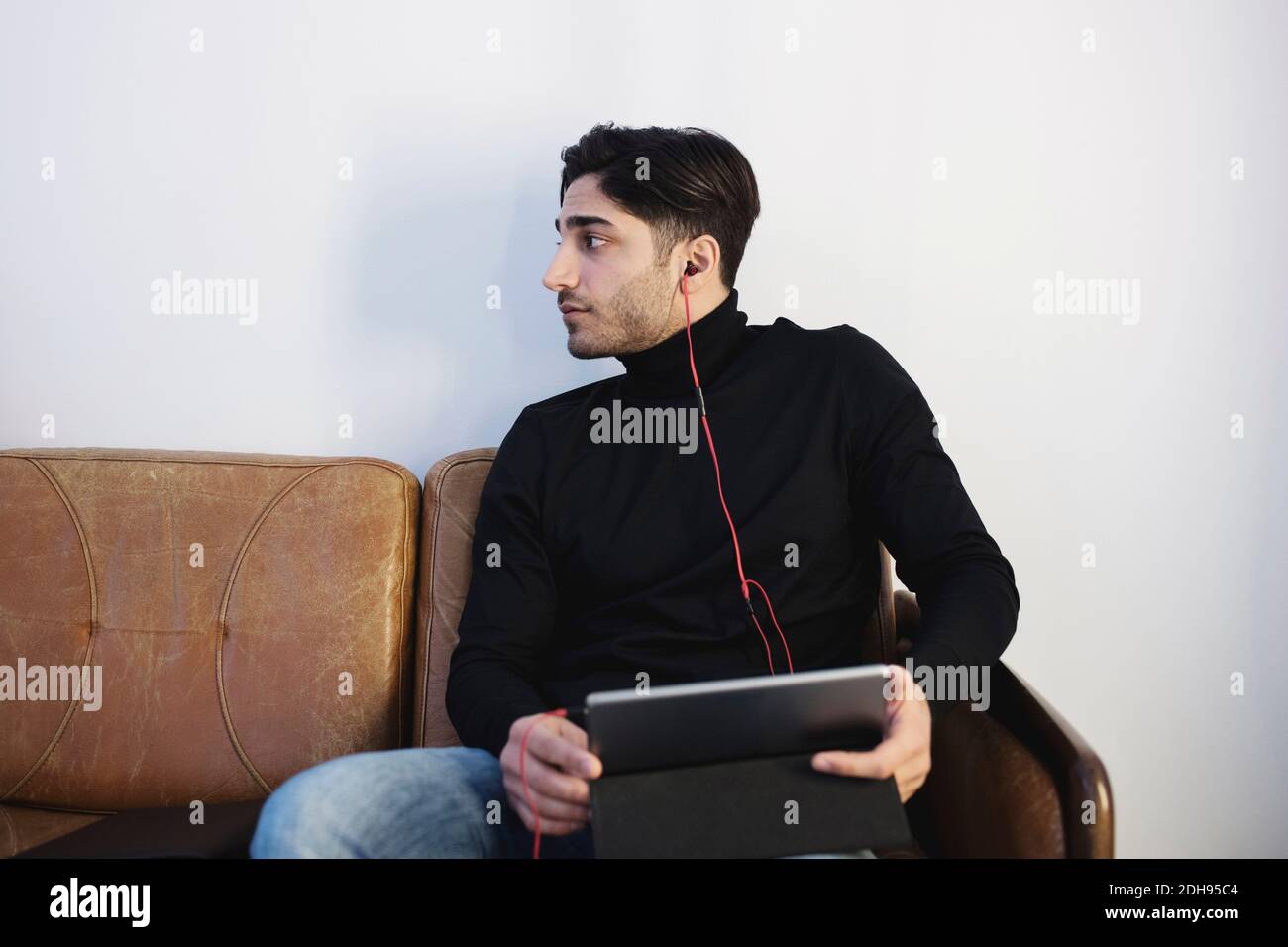 Man listening music on digital hi-res stock photography and images - Alamy