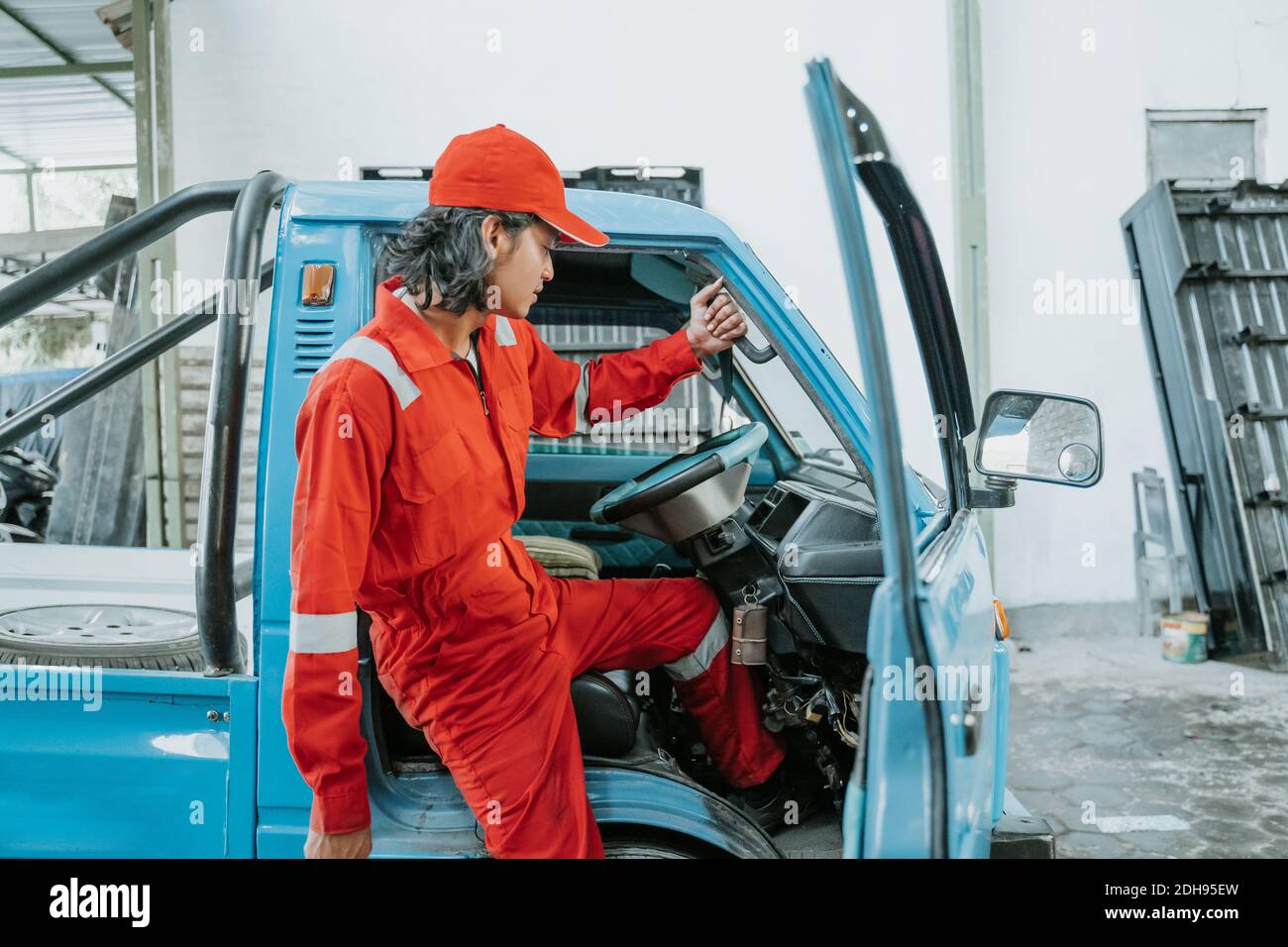 portrait of young asian man repairing a broken car engine part Stock ...