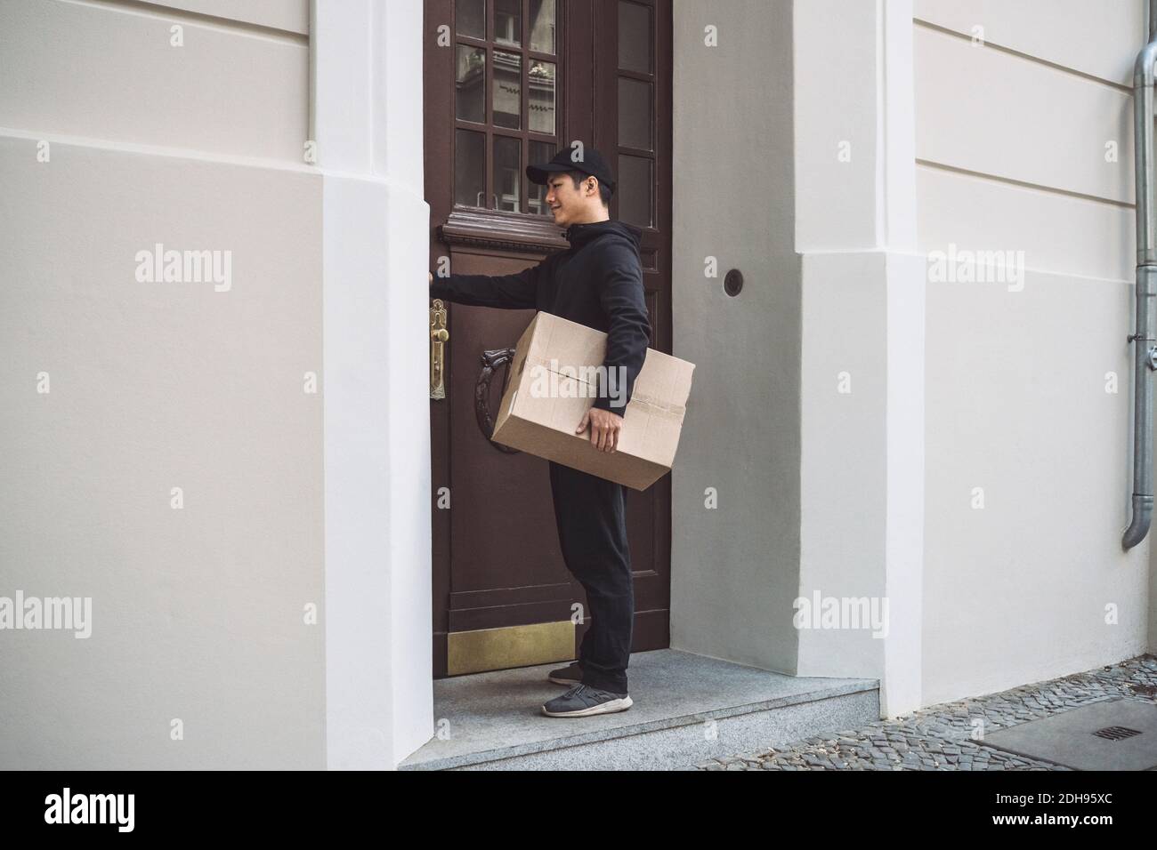 Indian man standing doorway hi-res stock photography and images - Alamy