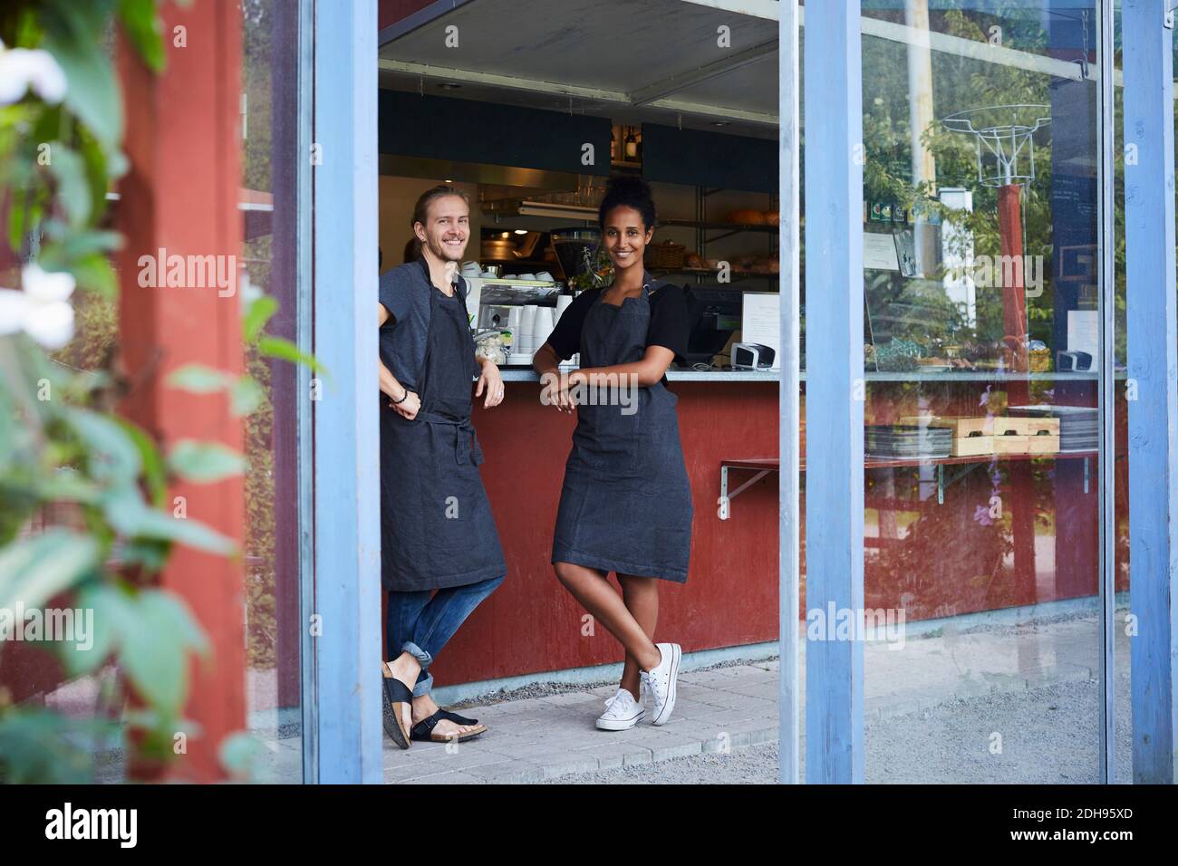 Cafe owner standing in entrance hi-res stock photography and images - Alamy
