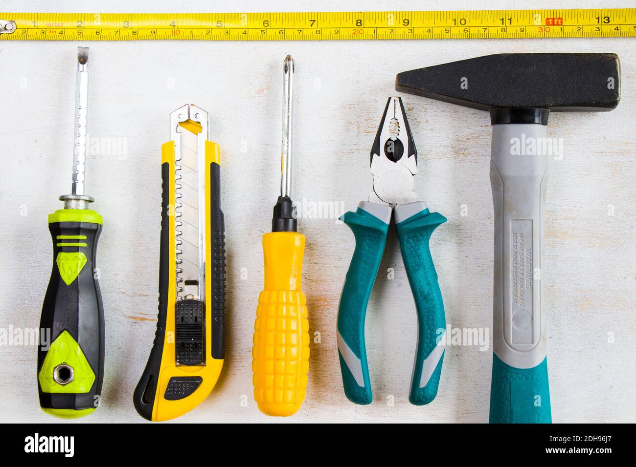 Building instrument set on the white background, tape measure, pliers ...