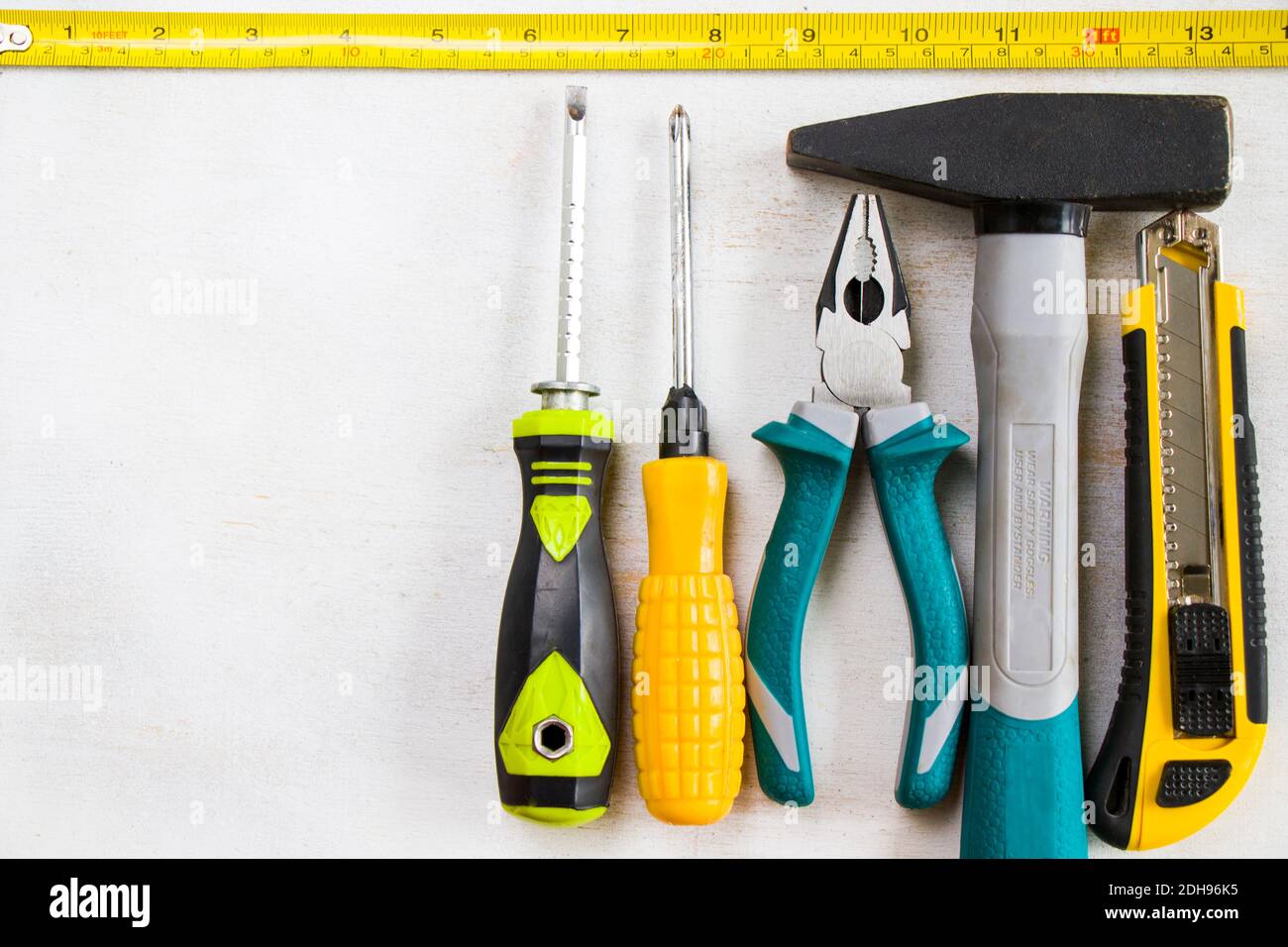 Building instrument set on the white background, tape measure, pliers ...
