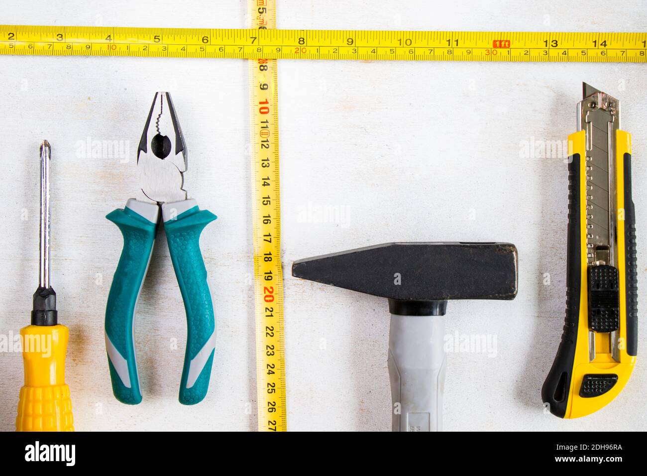 Building instrument set on the white background, tape measure, pliers ...