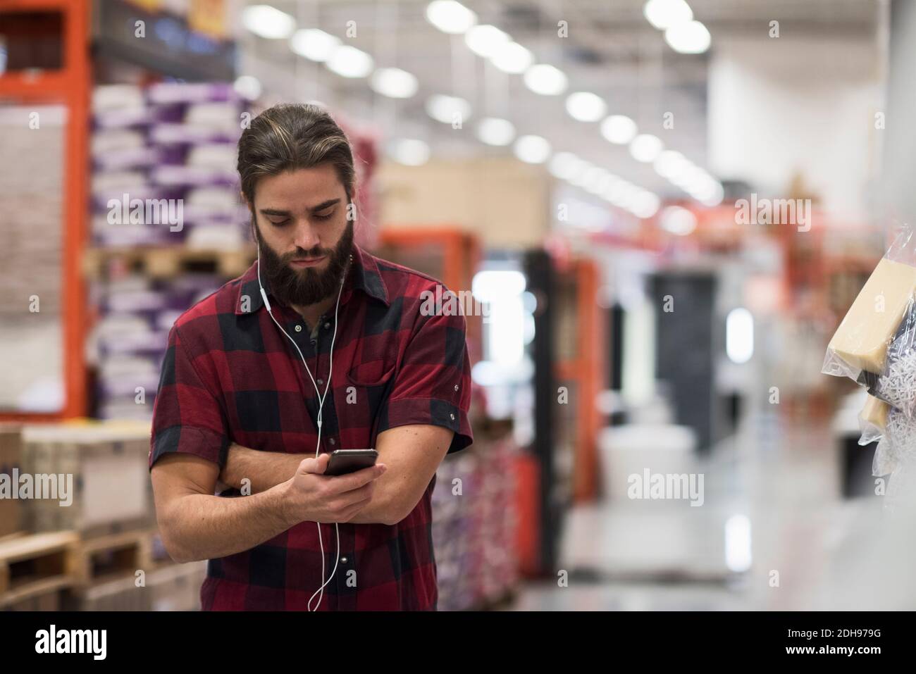 Customer holding mobile device in store hi-res stock photography and ...