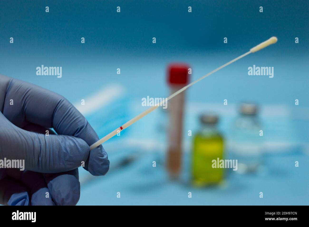Doctor's hand with test swab Stock Photo - Alamy