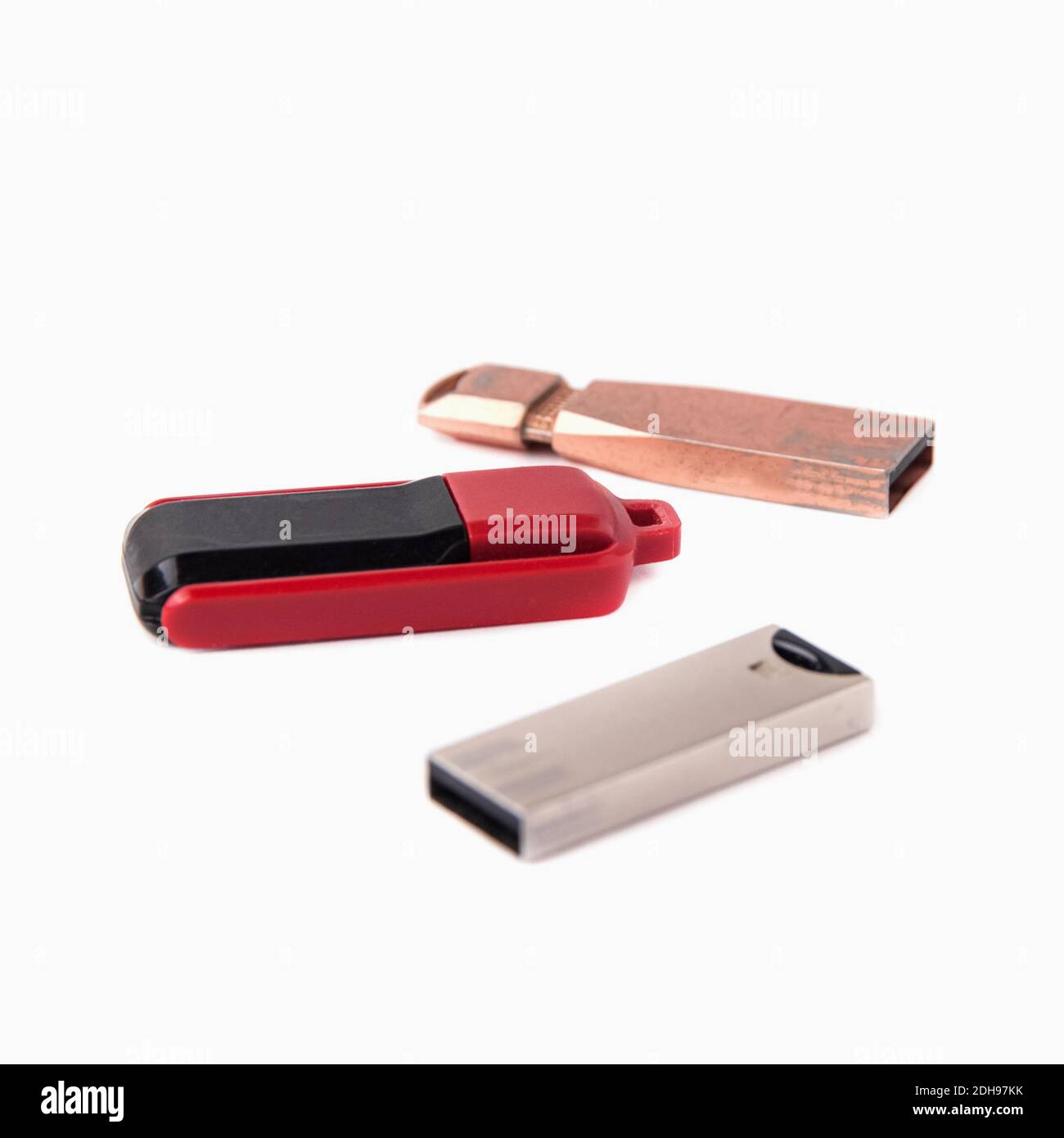 Three old USB flash drives isolated on a white background. Close up ...