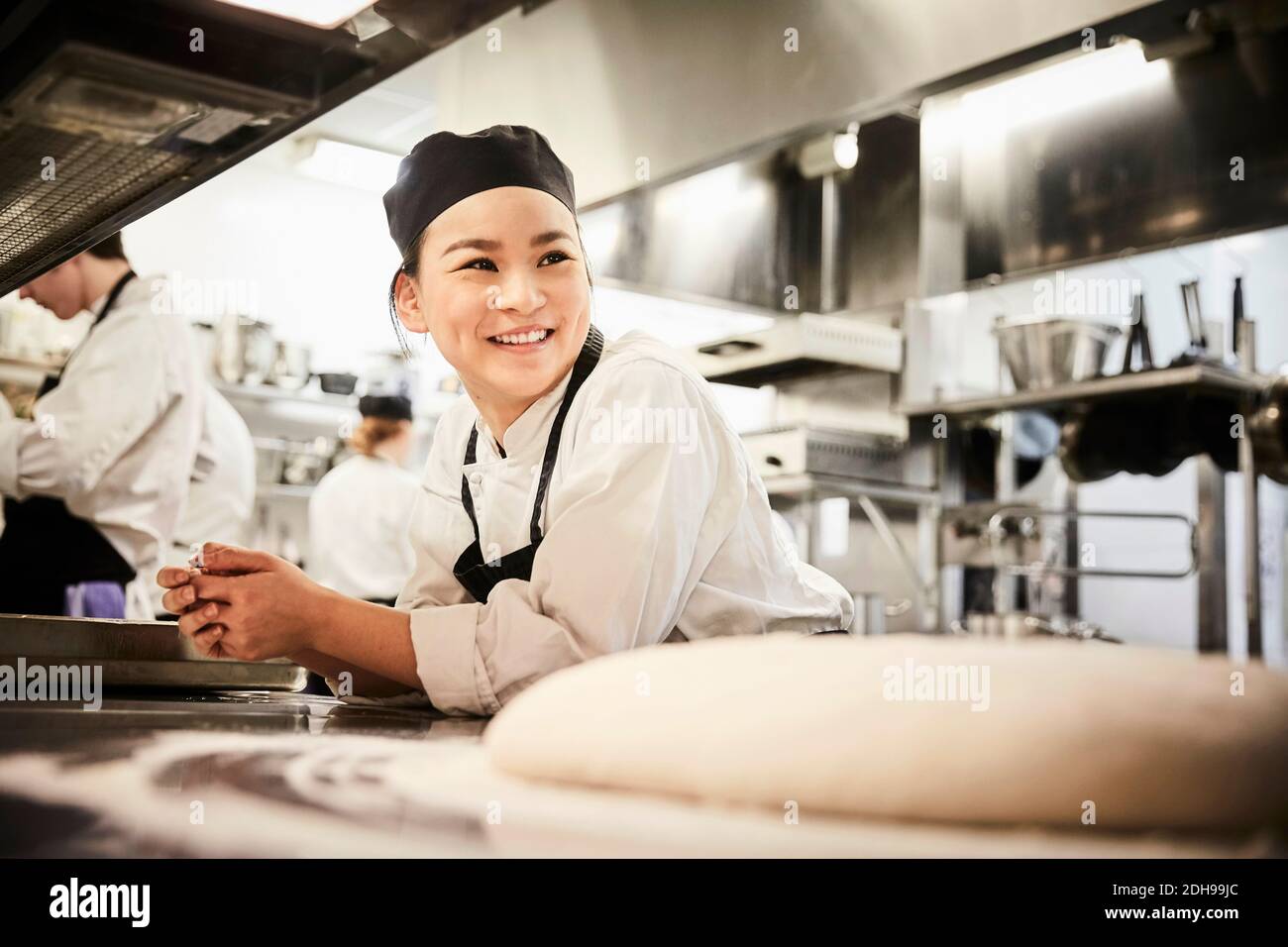 Leaning on counter hi-res stock photography and images - Alamy