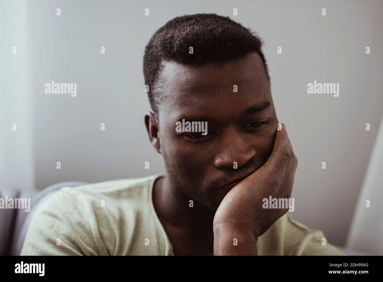 African man sitting worried hi-res stock photography and images - Alamy
