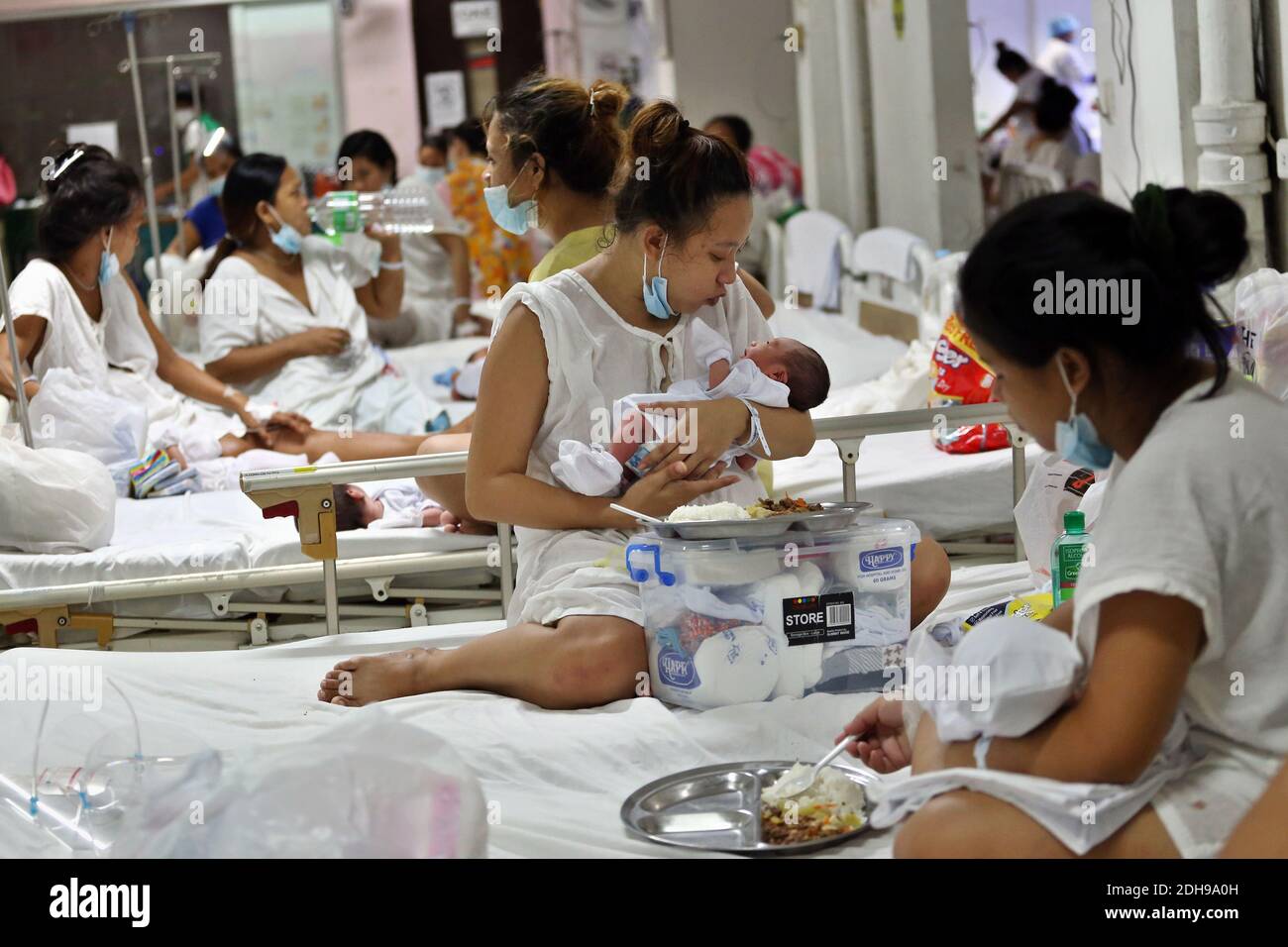 Manila, Philippines. 08th Dec, 2020. Mothers hold their newborn ...