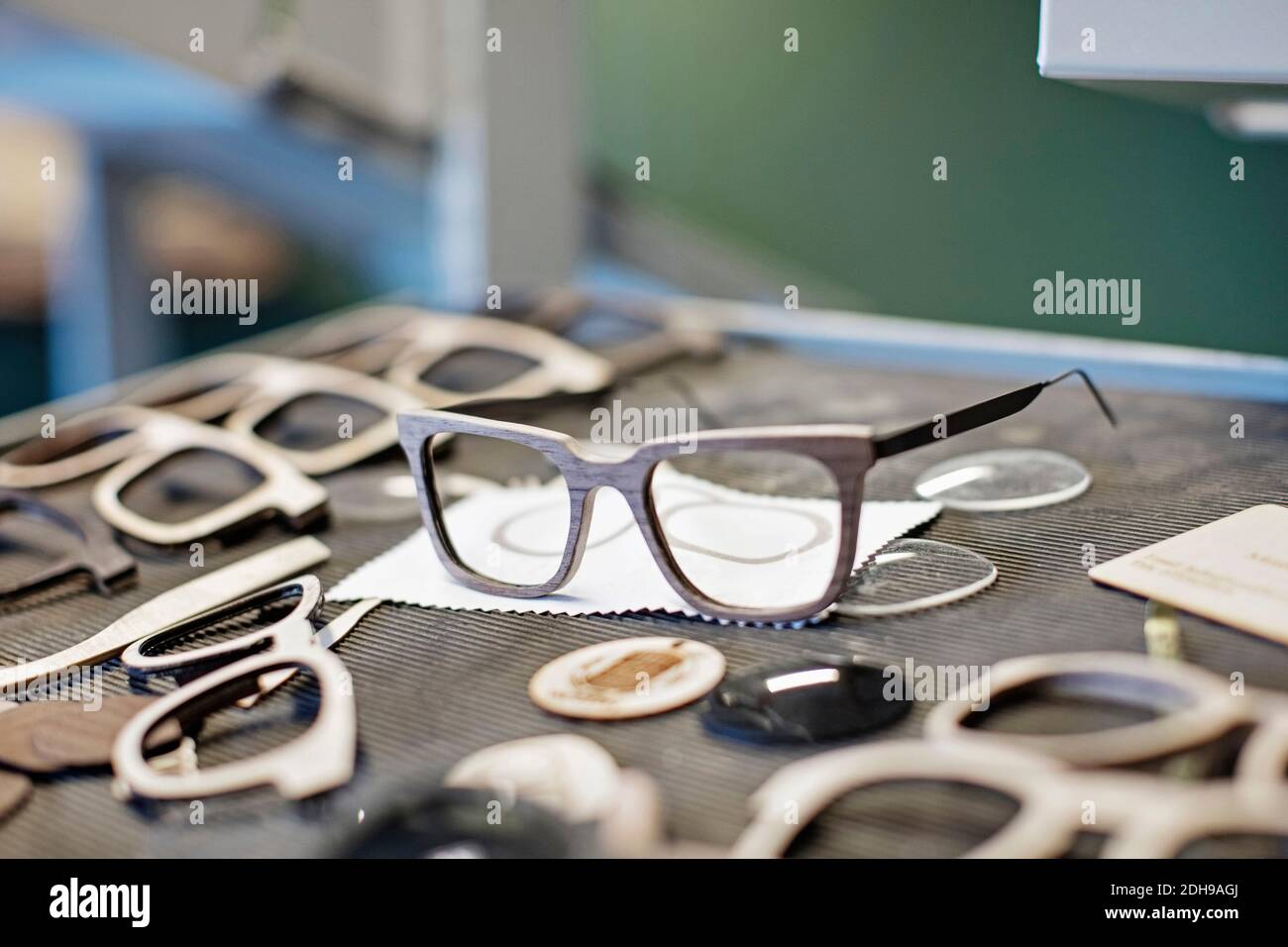 Eyeglasses frames on table at workshop Stock Photo - Alamy