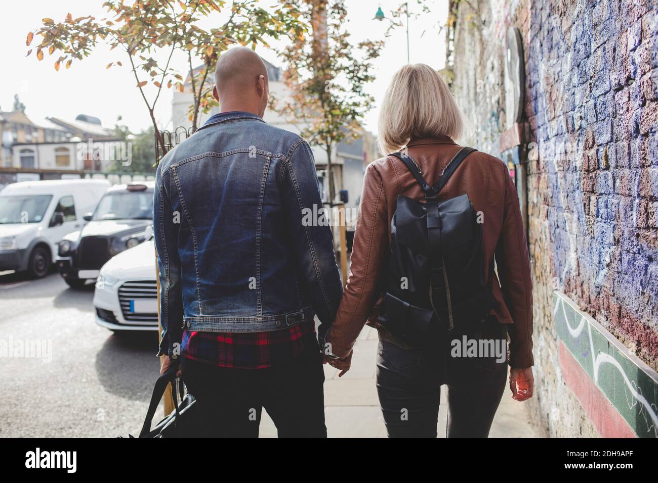 Back view couple holding hands hi-res stock photography and images - Alamy