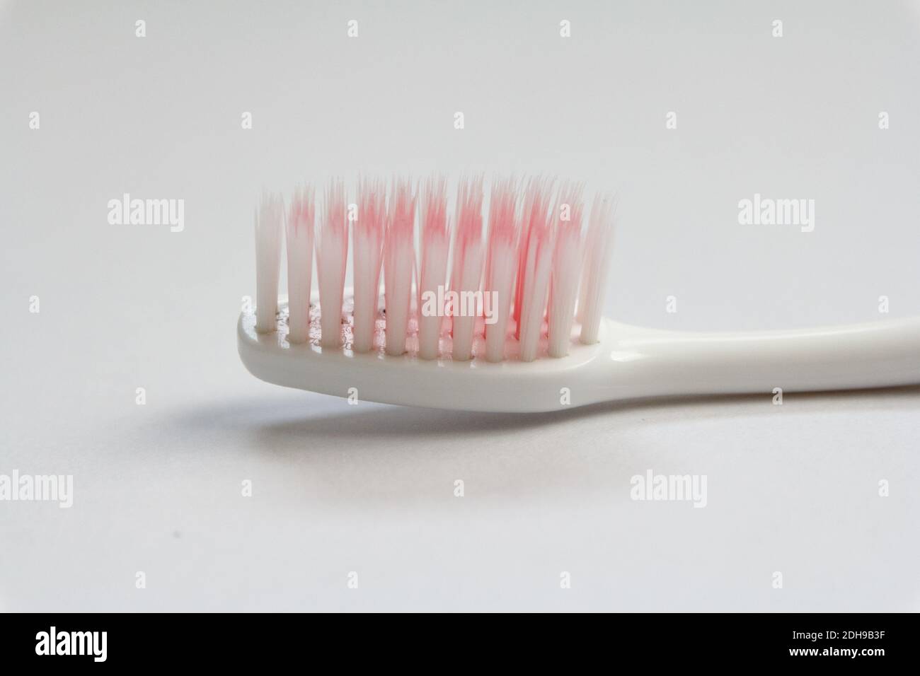 Close up old toothbrush isolated on white background Stock Photo - Alamy