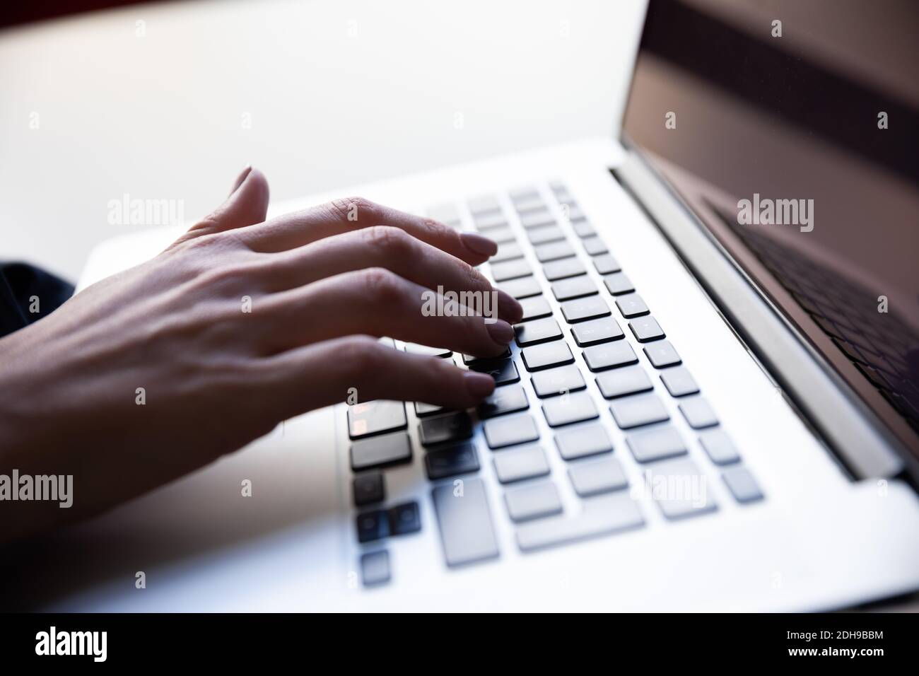 Mid section of woman using laptop Stock Photo - Alamy
