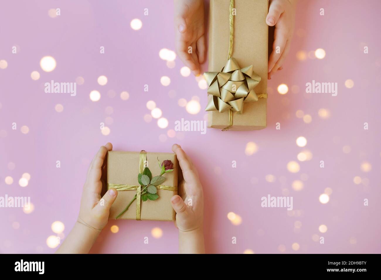 Cropped image of children's hands exchanging Christmas gifts Stock ...