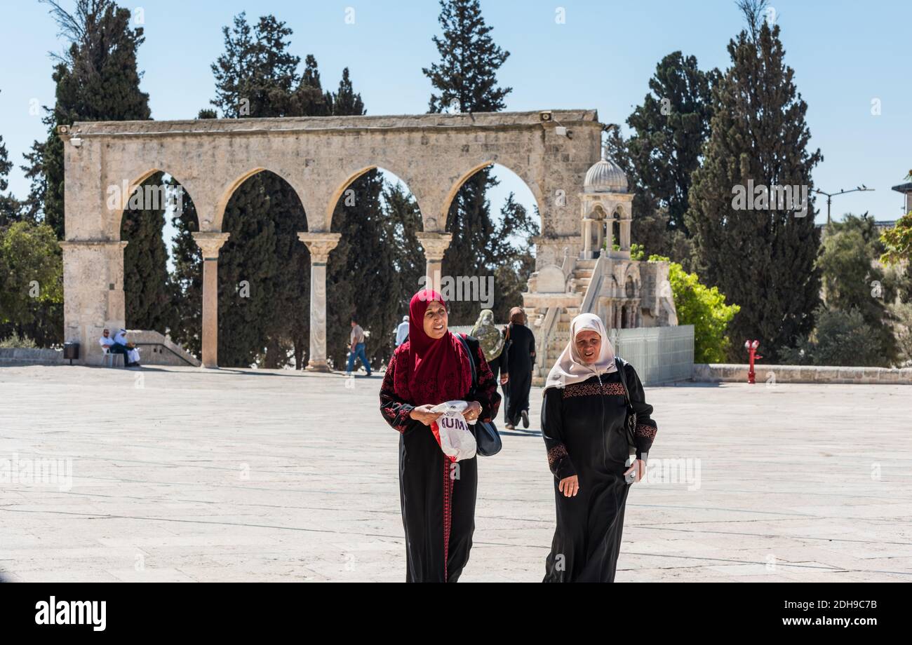 Muslim woman walking at the platform of the Golden Dome of the Rock ...