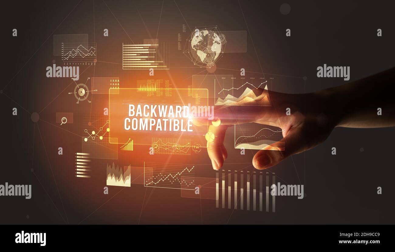 Hand touching BACKWARD COMPATIBLE inscription, new business technology ...