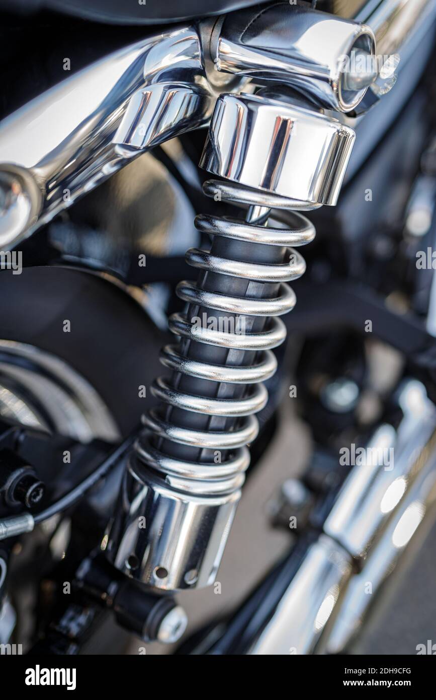 Motorcycle shock absorber in chrome Stock Photo - Alamy