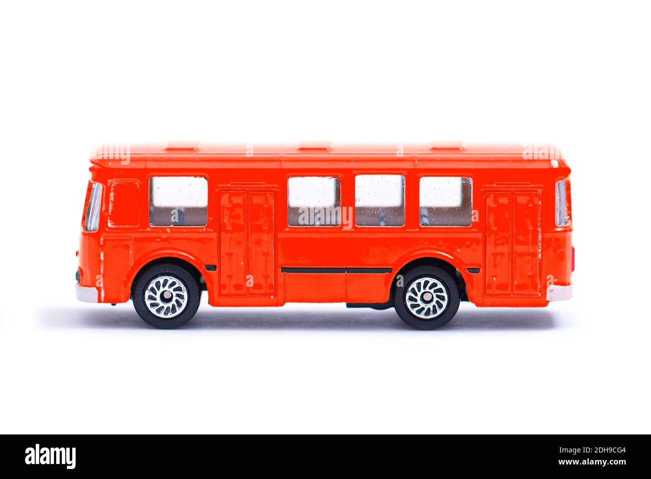 Plastic model of an old red bus, toy, miniature isolated on white Stock ...